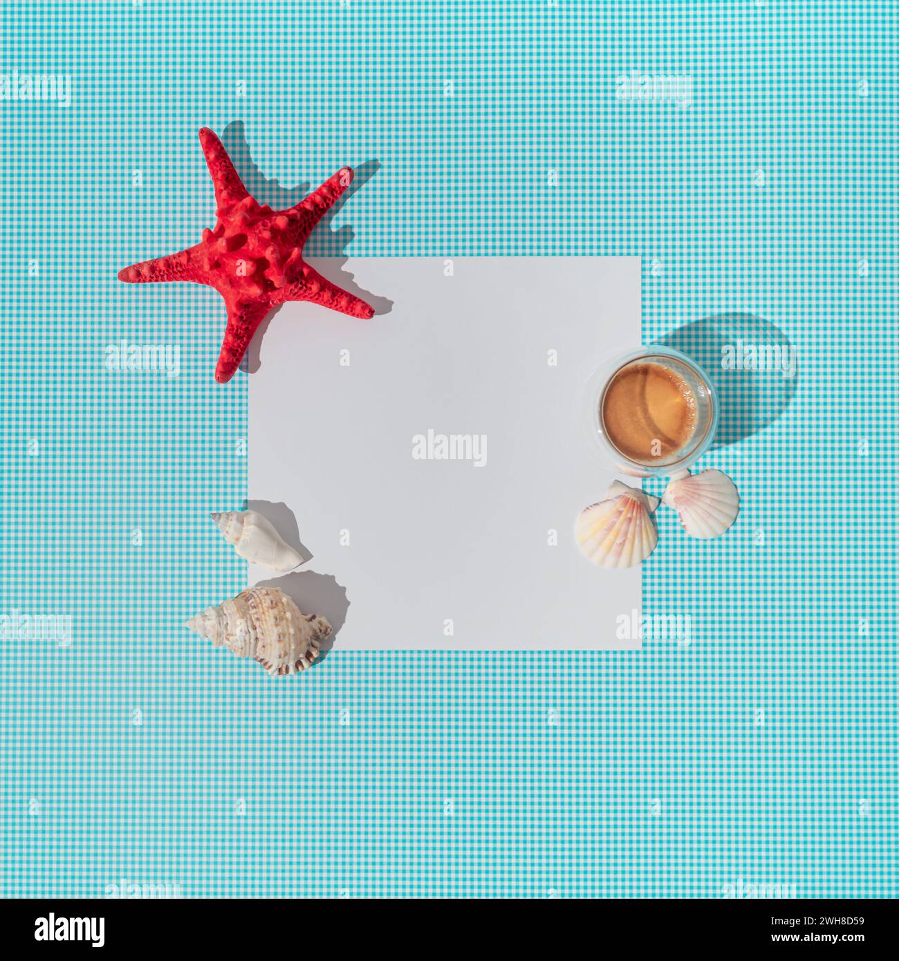 Creative summer layout made with cup of coffee, red starfish, sea ...