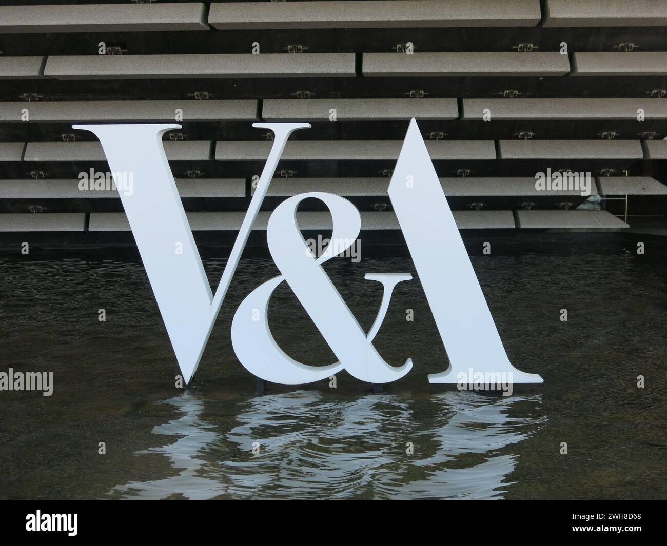 Close-up of the iconic V&A logo floating in the water feature in front ...