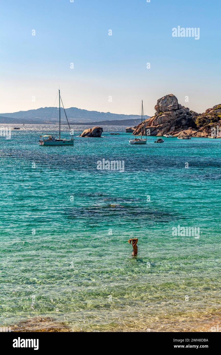 Woman enjoying the sea at Cala Corsara cove on the island of Spargi in ...