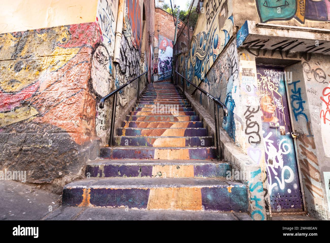 Handshake, a colorfully painted staircase in the alleyways of ...