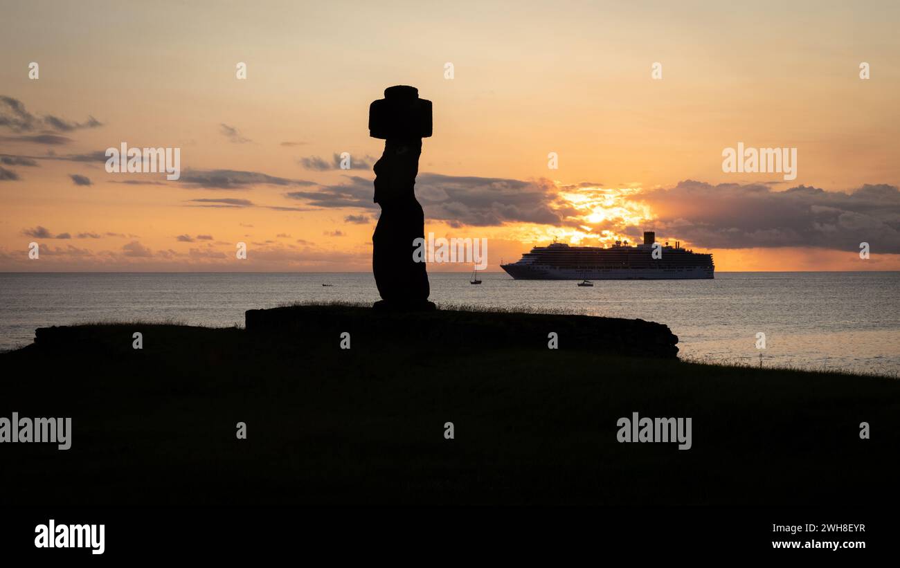 The Moai of Ahu Tahai at sunset with a cruise ship in the background on ...