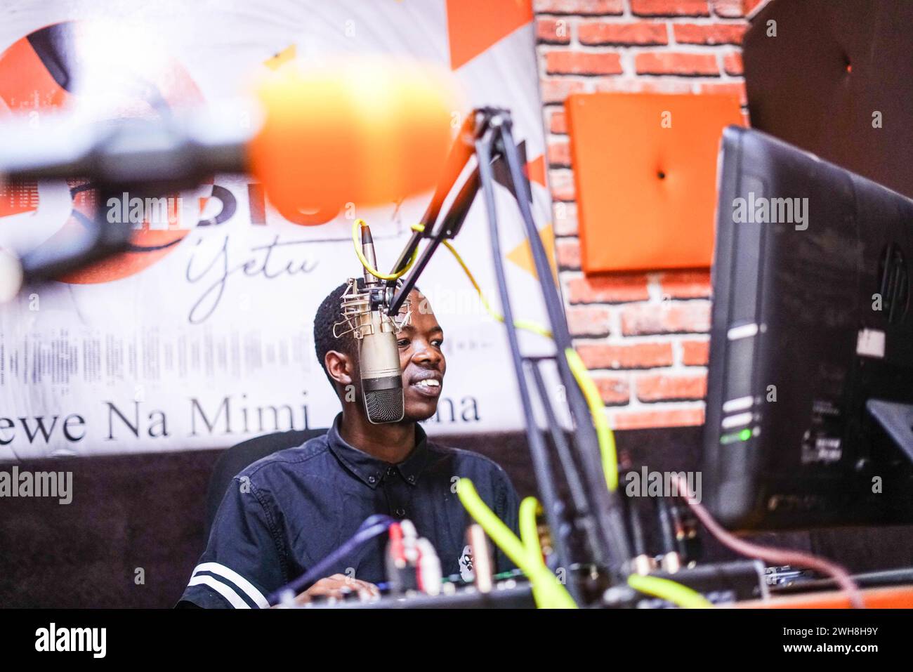 Nakuru, Kenya. 06th Feb, 2024. Brian Kennedy hosts the radio program ...