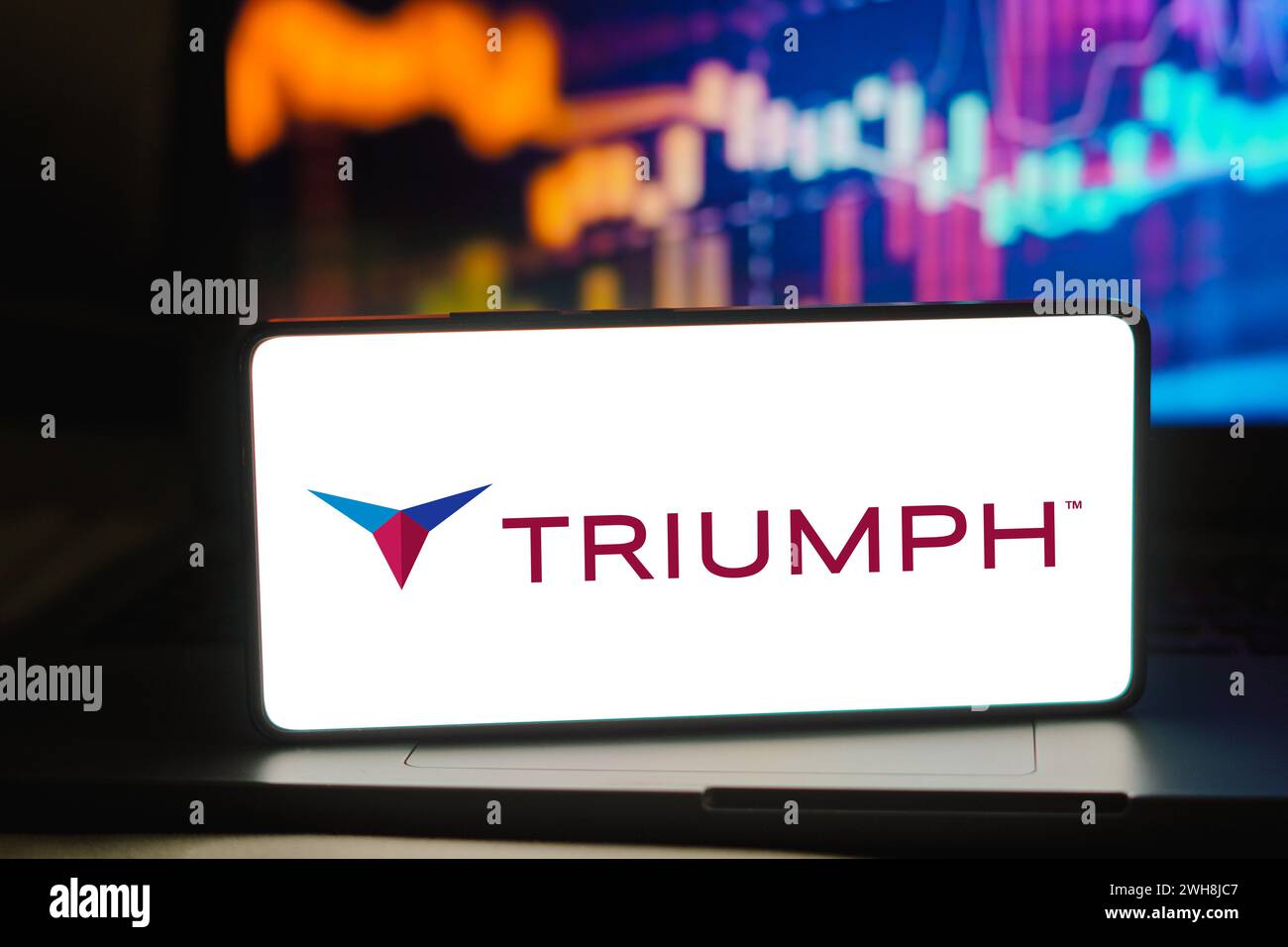 In this photo illustration, the Triumph Group logo is displayed on a ...