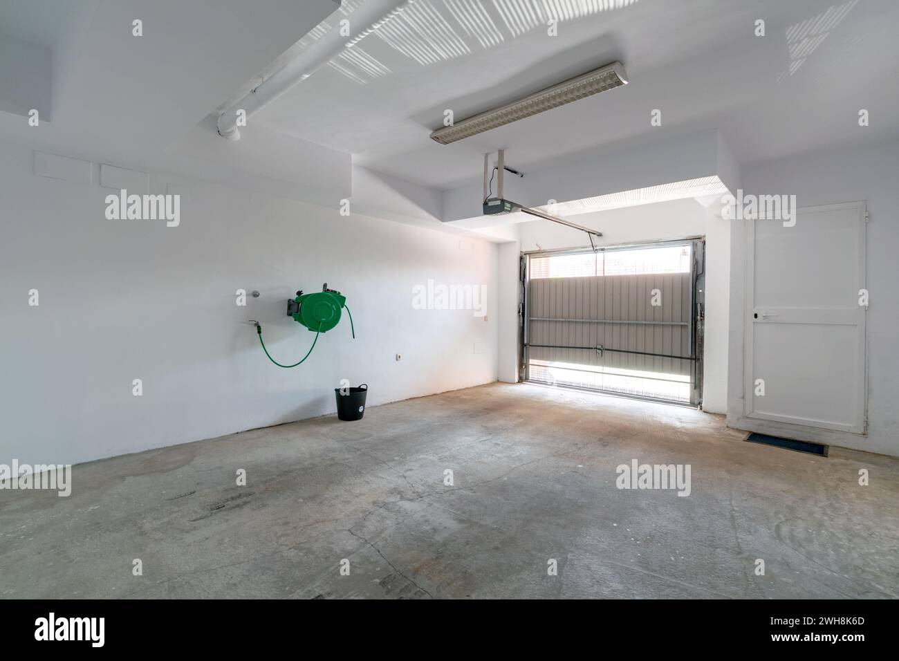 a large indoor private garage space in luxury mediterranean apartment ...