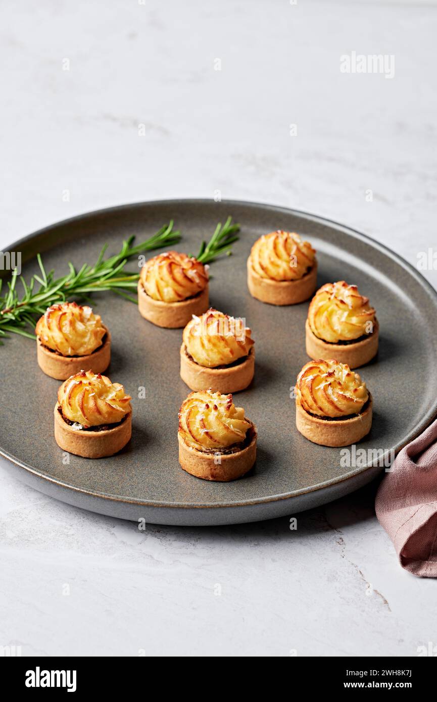 Mini lamb, pea & rosemary shepherds pie, parmesan & garlic duchess ...