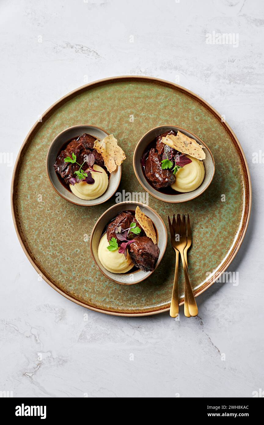 Slow cooked beef cheek, parsnip mash, red wine jus, seeded mustard ...
