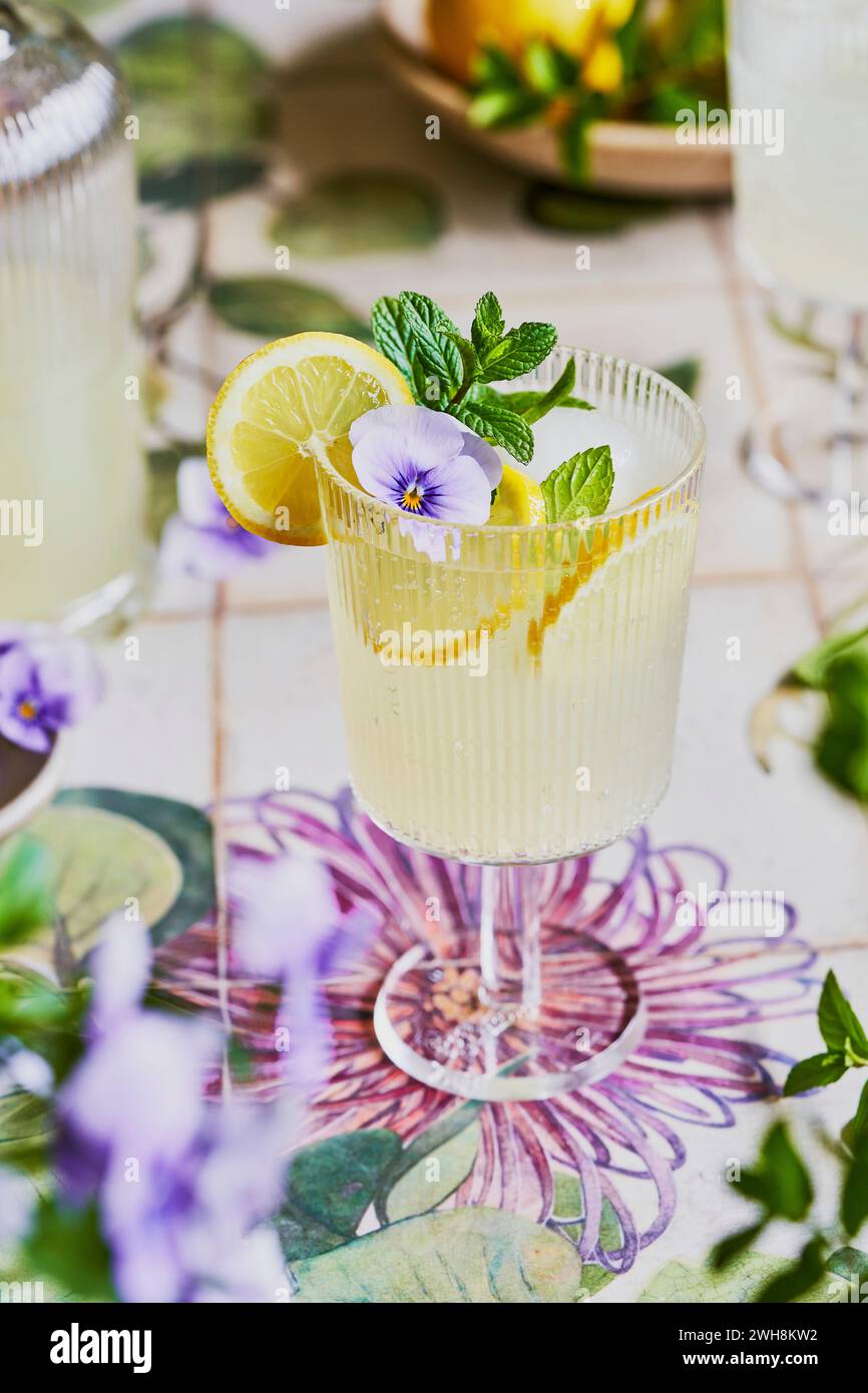 Lemon Mint Lemonade Mocktail on Floral Background with Lemon, Mint and ...