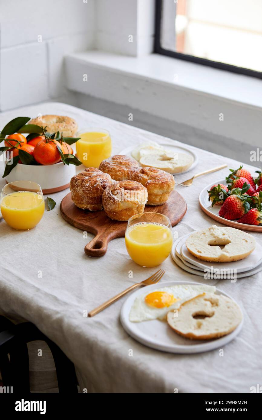 Breakfast Tablescape with Pastries, Orange Juice and Fruit Stock Photo ...