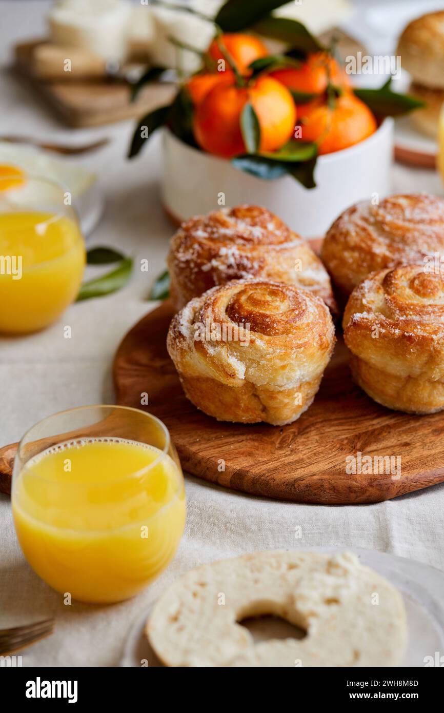 Breakfast Tablescape with Pastries, Orange Juice and Fruit Stock Photo ...