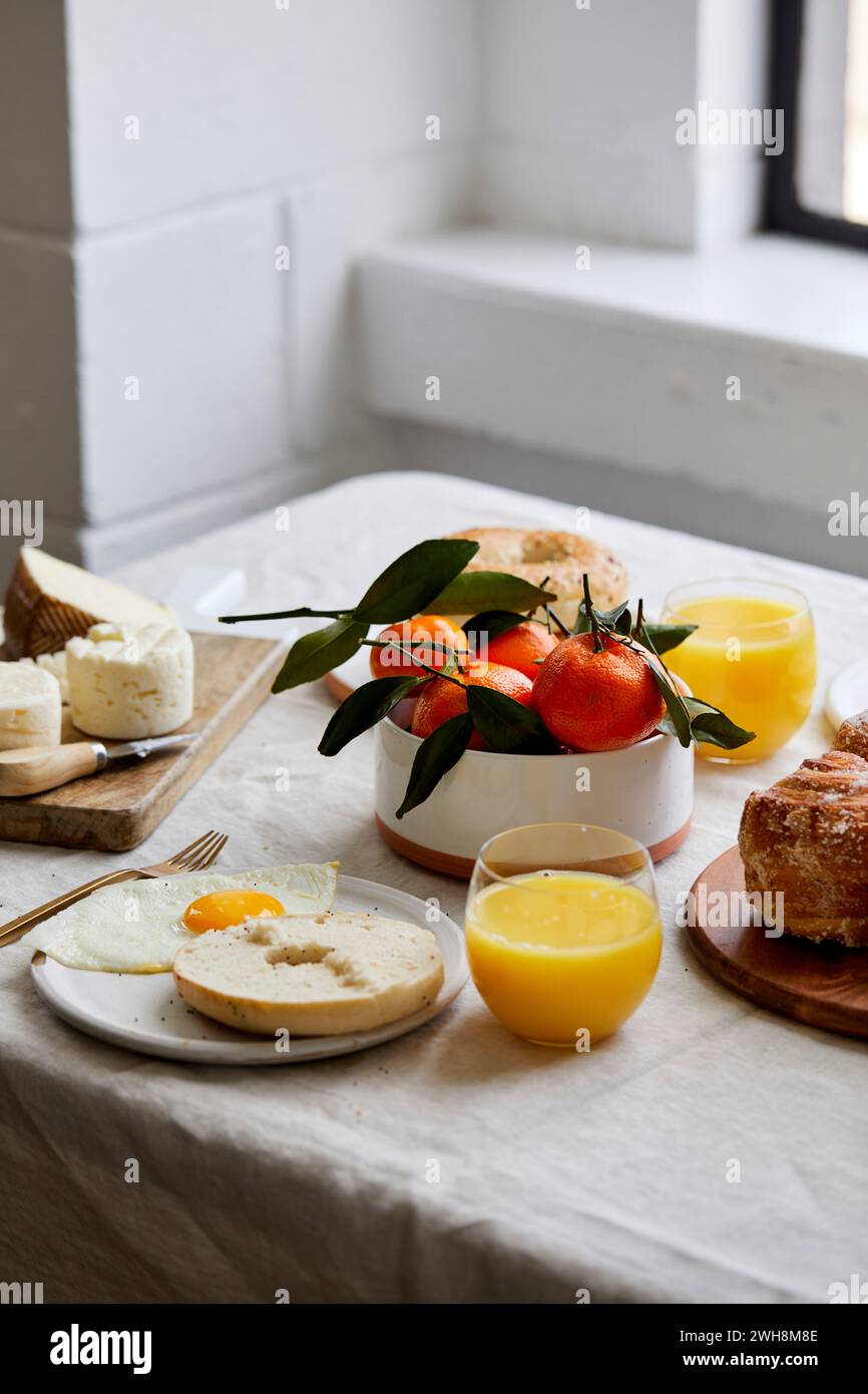 Breakfast Tablescape with Pastries, Orange Juice and Fruit Stock Photo ...