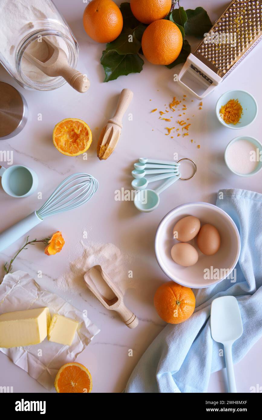 Baking preparation with ingredients for orange madeira cake on white ...