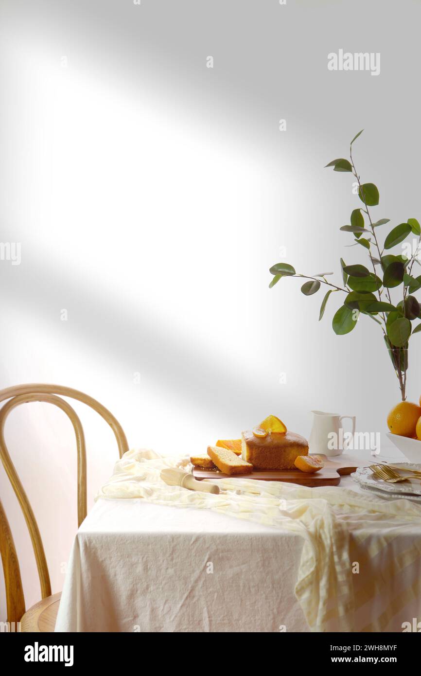 Afternoon tea table setting with orange madeira cake Stock Photo - Alamy