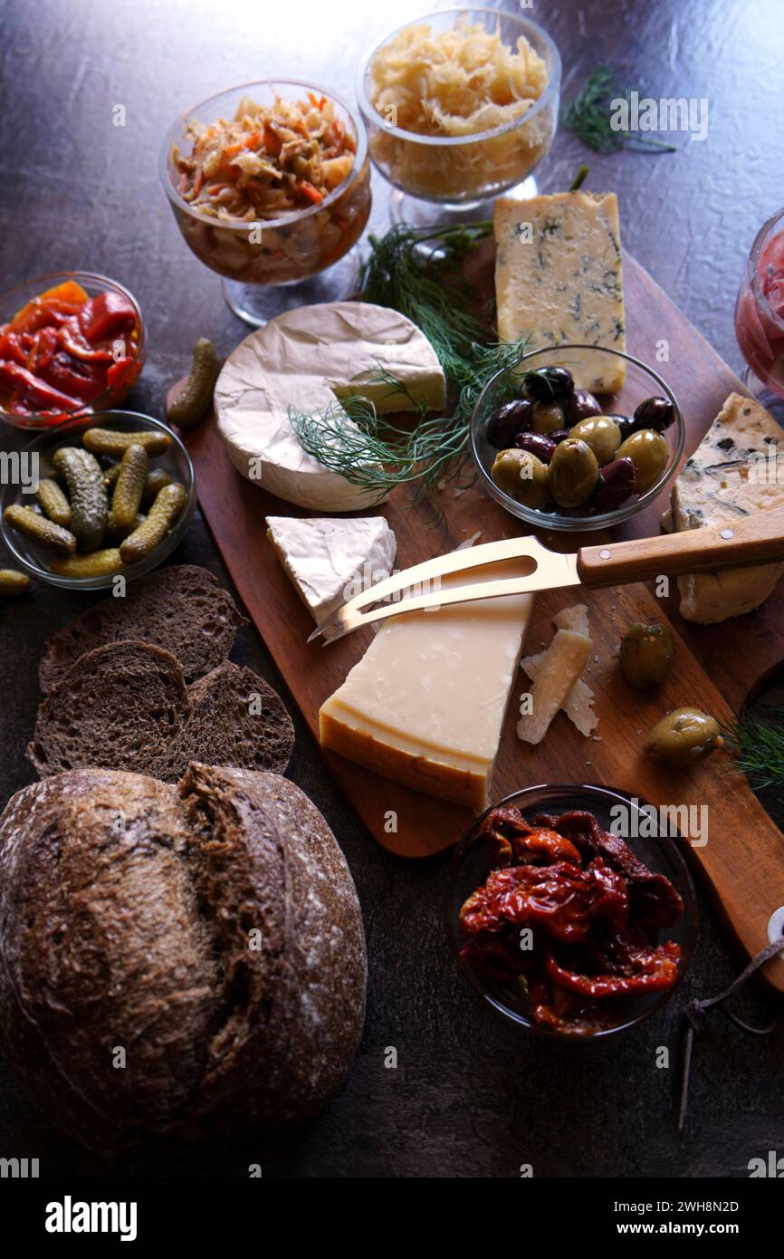Healthy probiotic cheese platter served with kimchi, dark dye sourdough ...