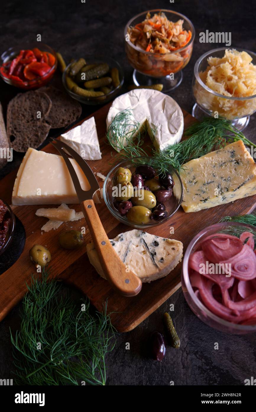 Healthy probiotic cheese platter served with kimchi, dark dye sourdough ...