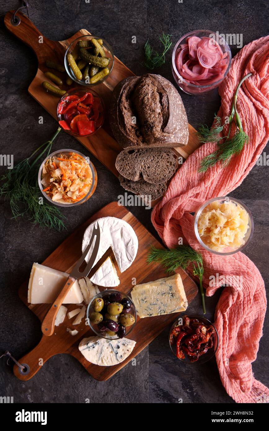 Healthy probiotic cheese platter served with kimchi, dark dye sourdough ...