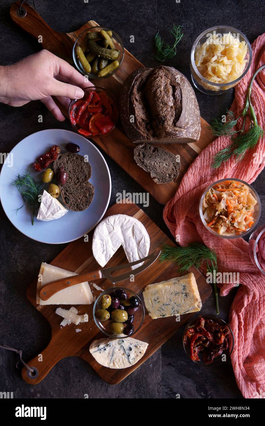 Healthy probiotic cheese platter served with kimchi, dark dye sourdough ...