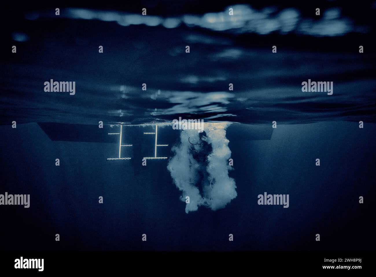The beauty of the underwater world - diver jumping from boat into water ...
