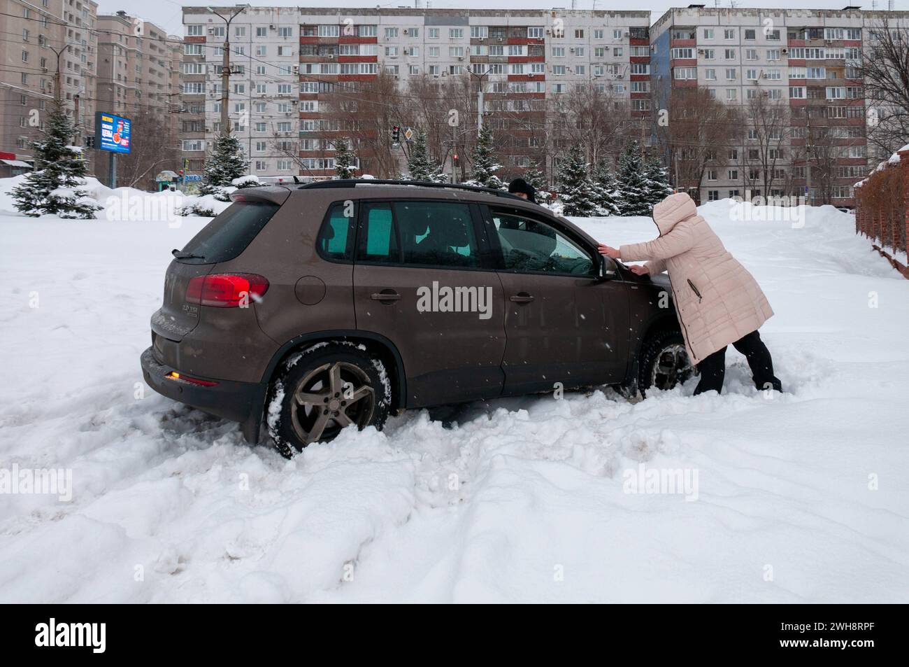 Consequences of snowfall A stuck car in the snow after a snowfall ...
