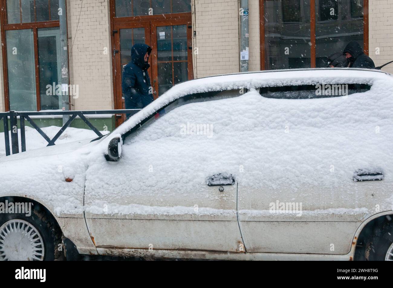 Consequences of snowfall A car covered with snow after a snowfall ...