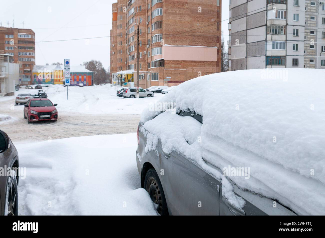 Consequences of snowfall A car covered with snow after a snowfall ...