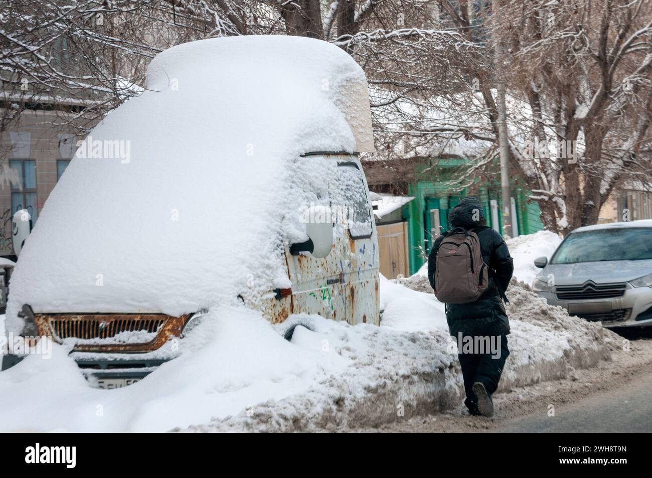Consequences of snowfall A car covered with snow after a snowfall ...