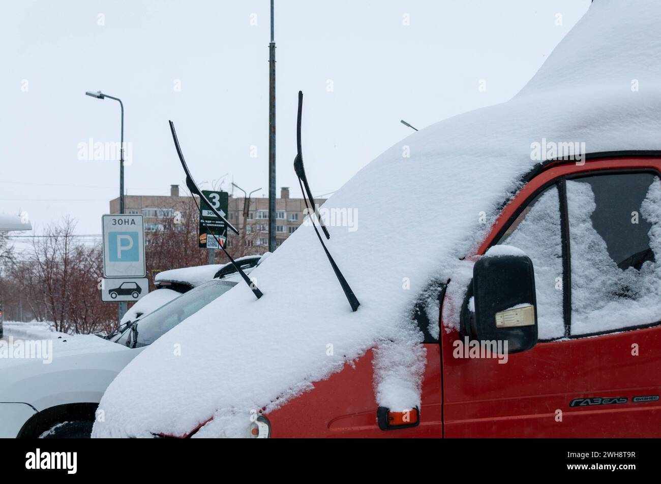 Consequences of snowfall A car covered with snow after a snowfall ...
