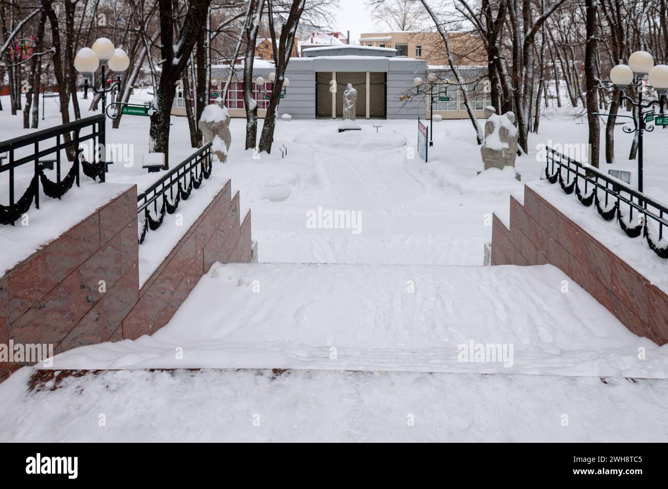 Consequences of snowfall A staircase covered with snow in Victory Park ...