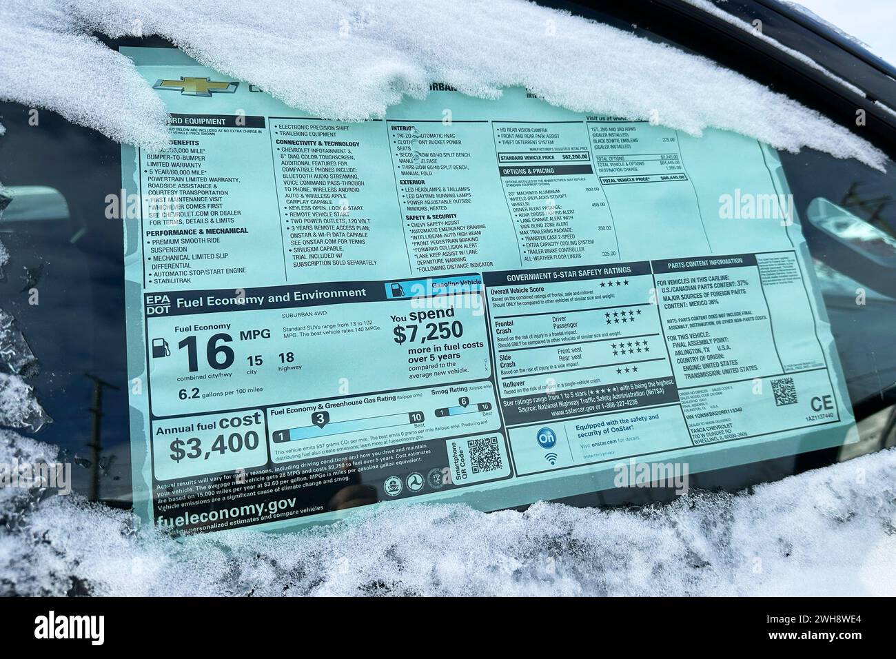A price sticker is shown on a car at a dealership in Wheeling, Ill ...