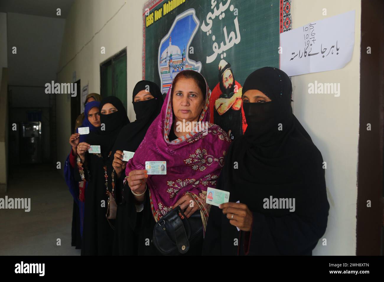 Pakistani womens showing their national ID card outside the polling ...