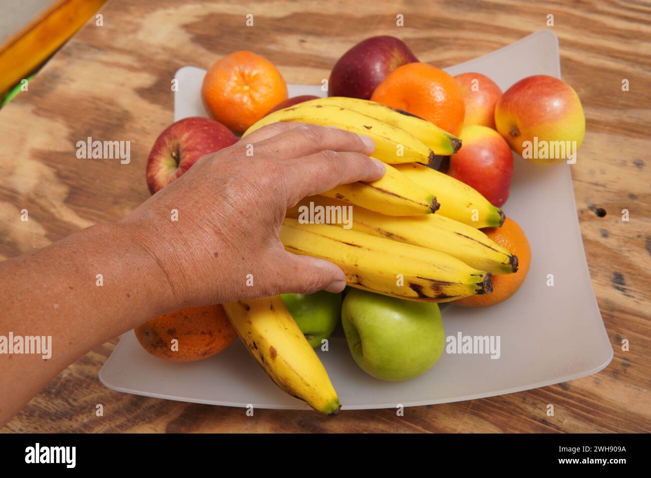 Mans hand picking apples in hi-res stock photography and images - Alamy