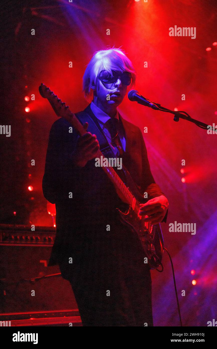 Deb DeMure of gothic rock band Drab Majesty playing guitar live onstage ...