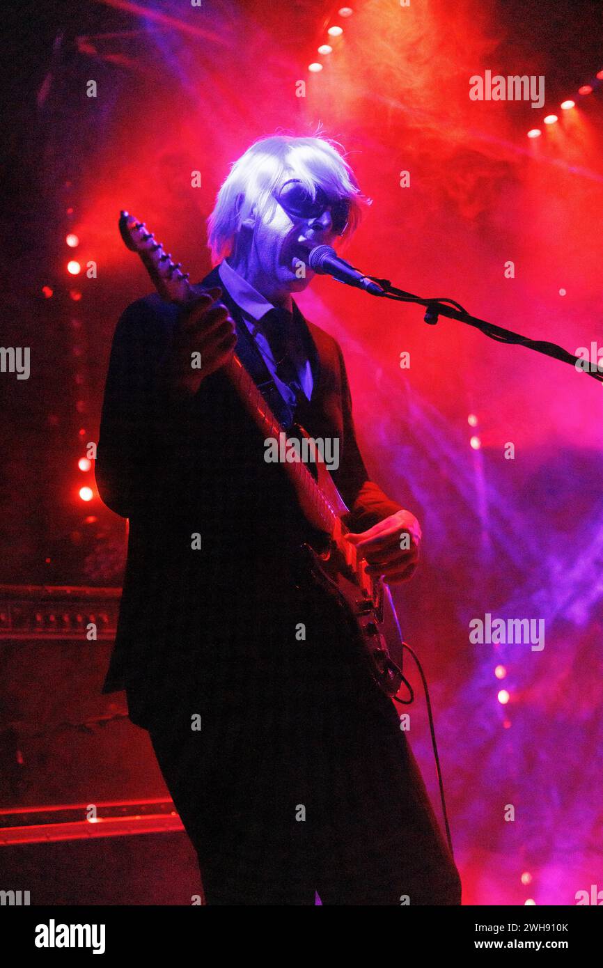 Deb DeMure of gothic rock band Drab Majesty playing guitar live onstage ...