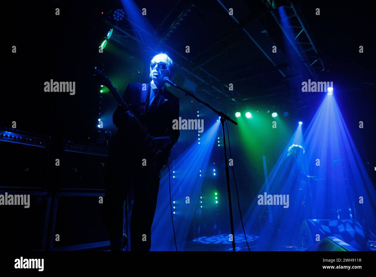 Drab Majesty performing live onstage as part of the band's 2024 tour ...