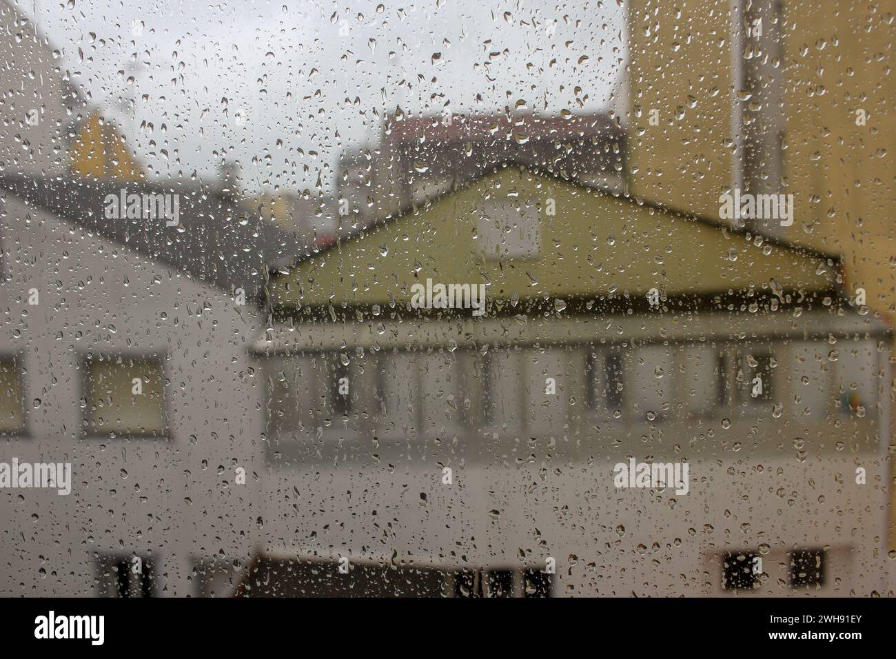 boring rainy day outside with raindrops in the pane windows Stock Photo ...