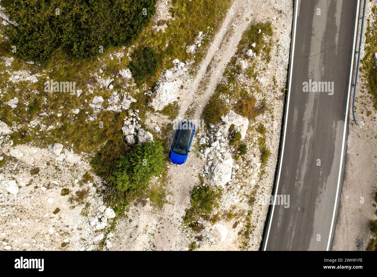 Aerial View of Blue Car Driving Down a Road Stock Photo - Alamy