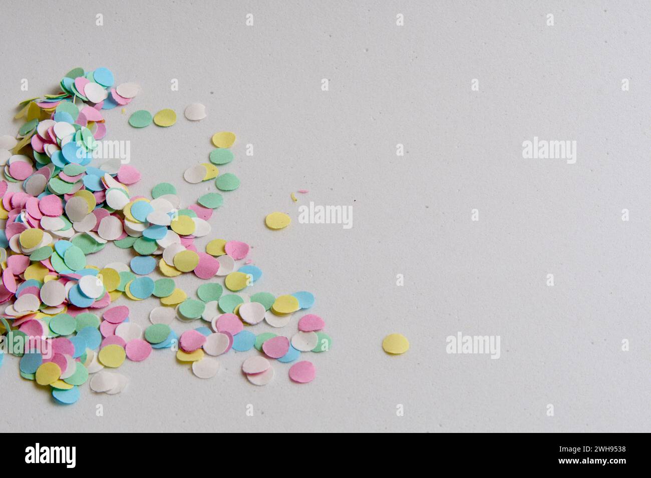 closeup of pastel colored confetti on white background Stock Photo - Alamy