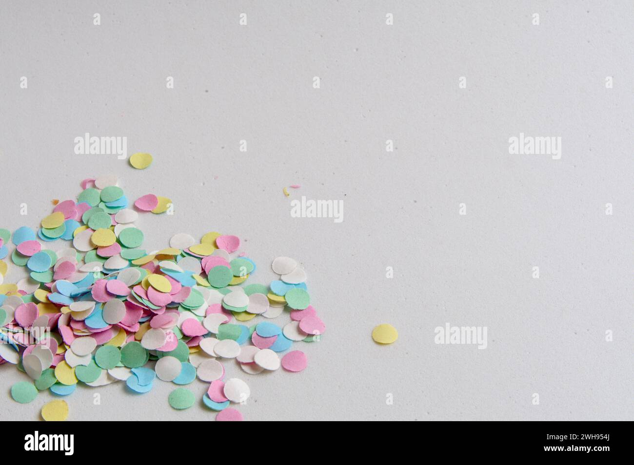 closeup of pastel colored confetti on white background Stock Photo - Alamy
