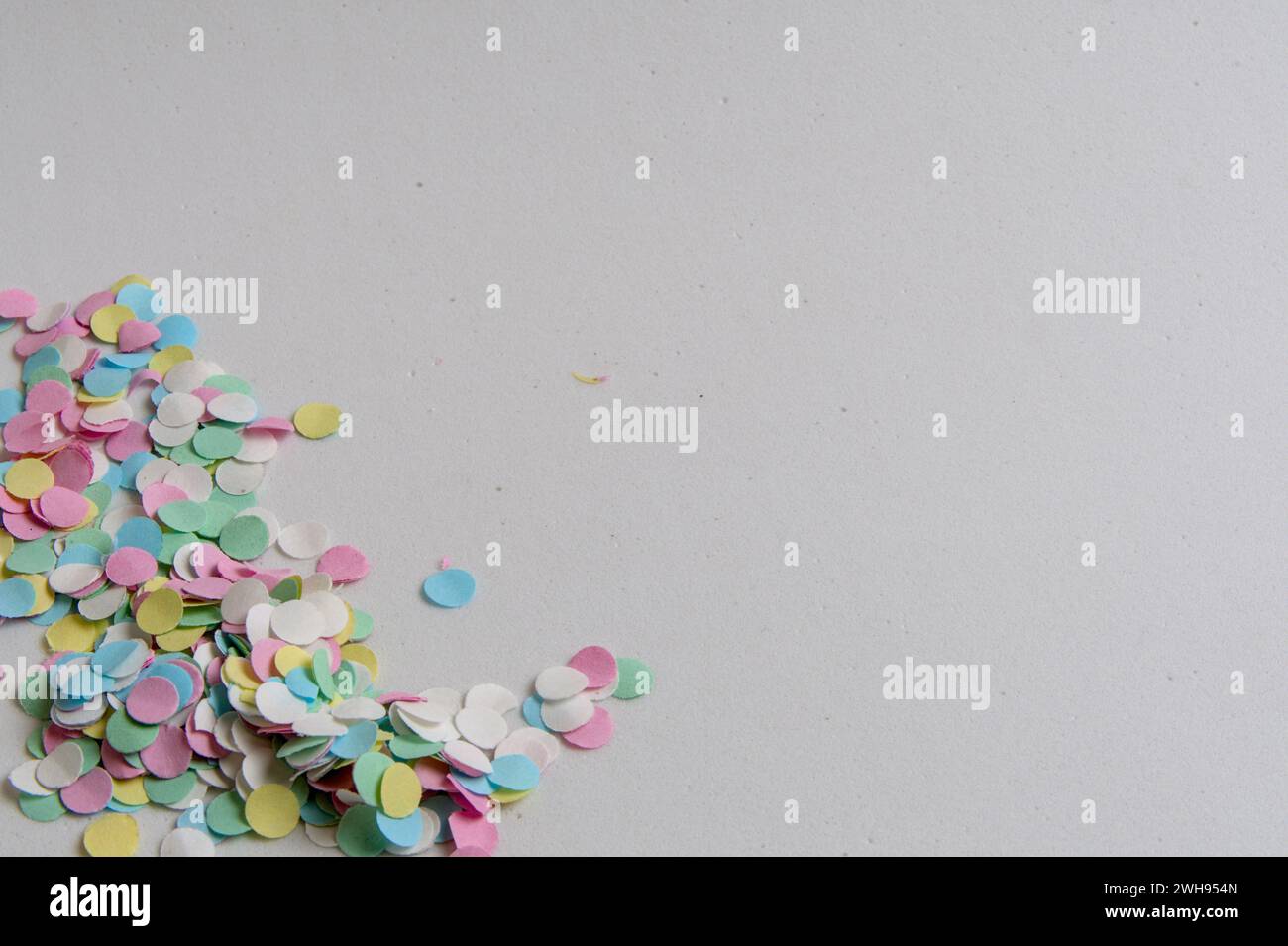 closeup of pastel colored confetti on white background Stock Photo - Alamy