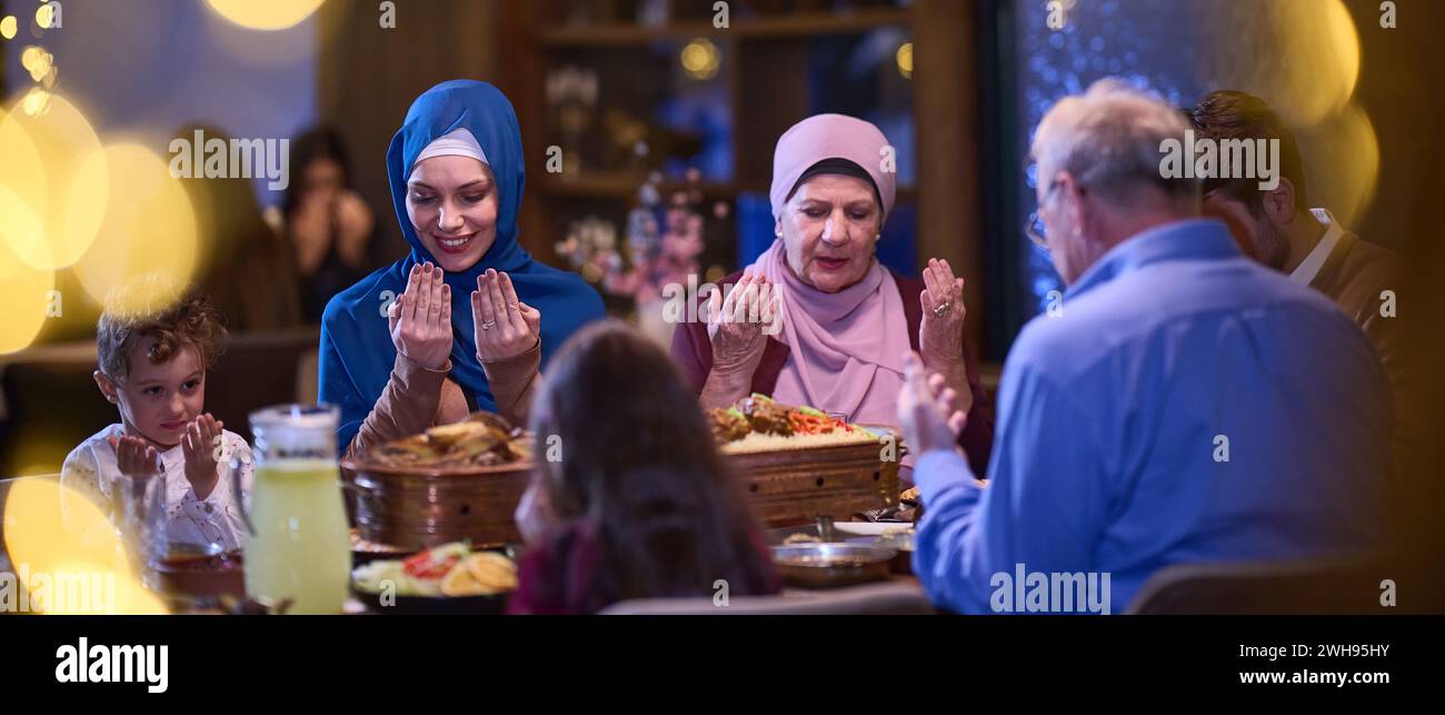 In a modern restaurant setting, a European Islamic family comes ...