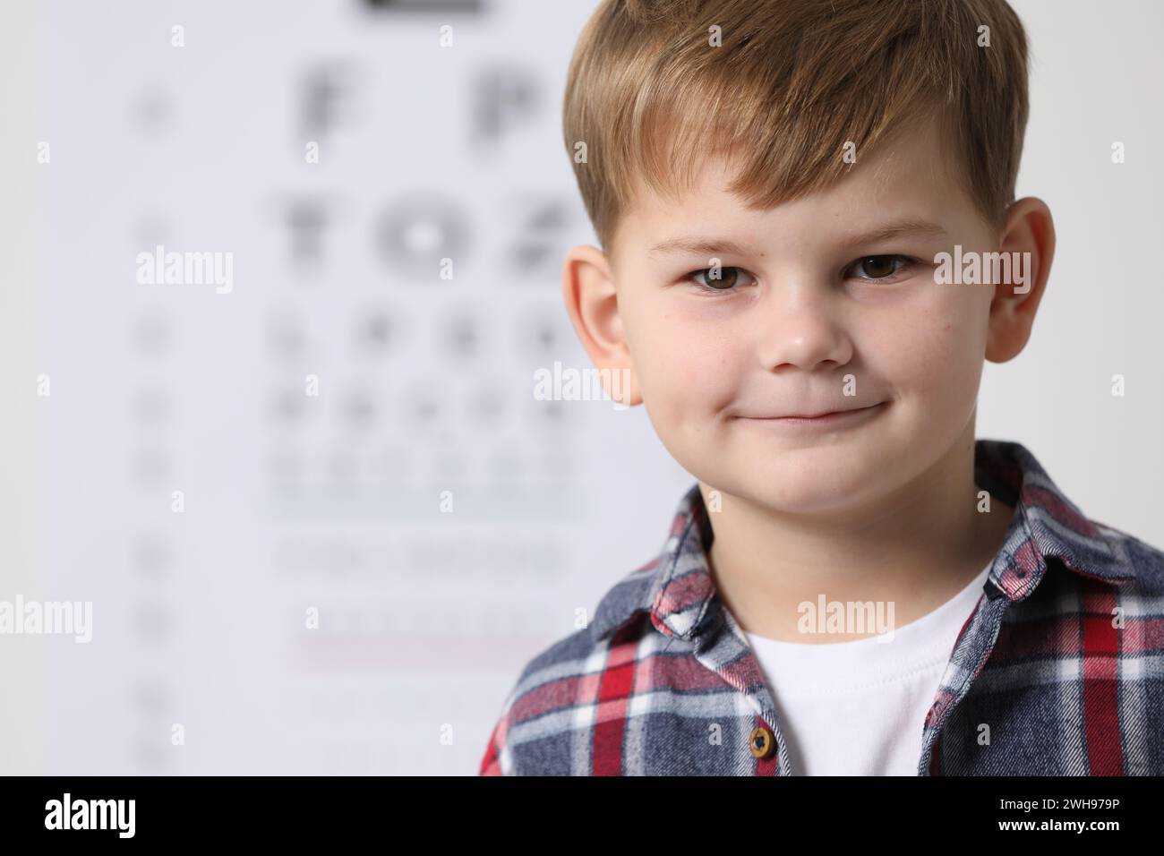 Portrait of cute little boy on blurred background Stock Photo - Alamy