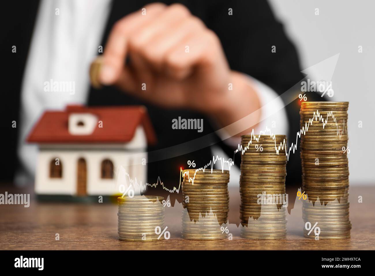 Mortgage rate. Stacked coins, percent signs, arrow and graphs. Woman ...