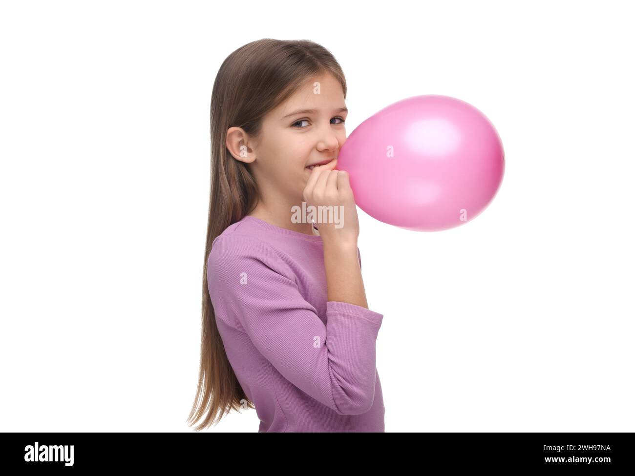 Girl inflating pink balloon on white background Stock Photo - Alamy
