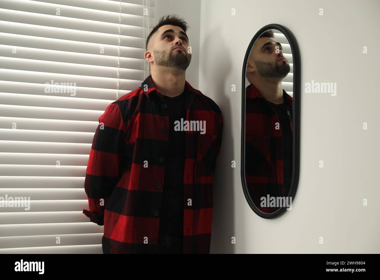 Mirror reflection face sad male hi-res stock photography and images - Alamy