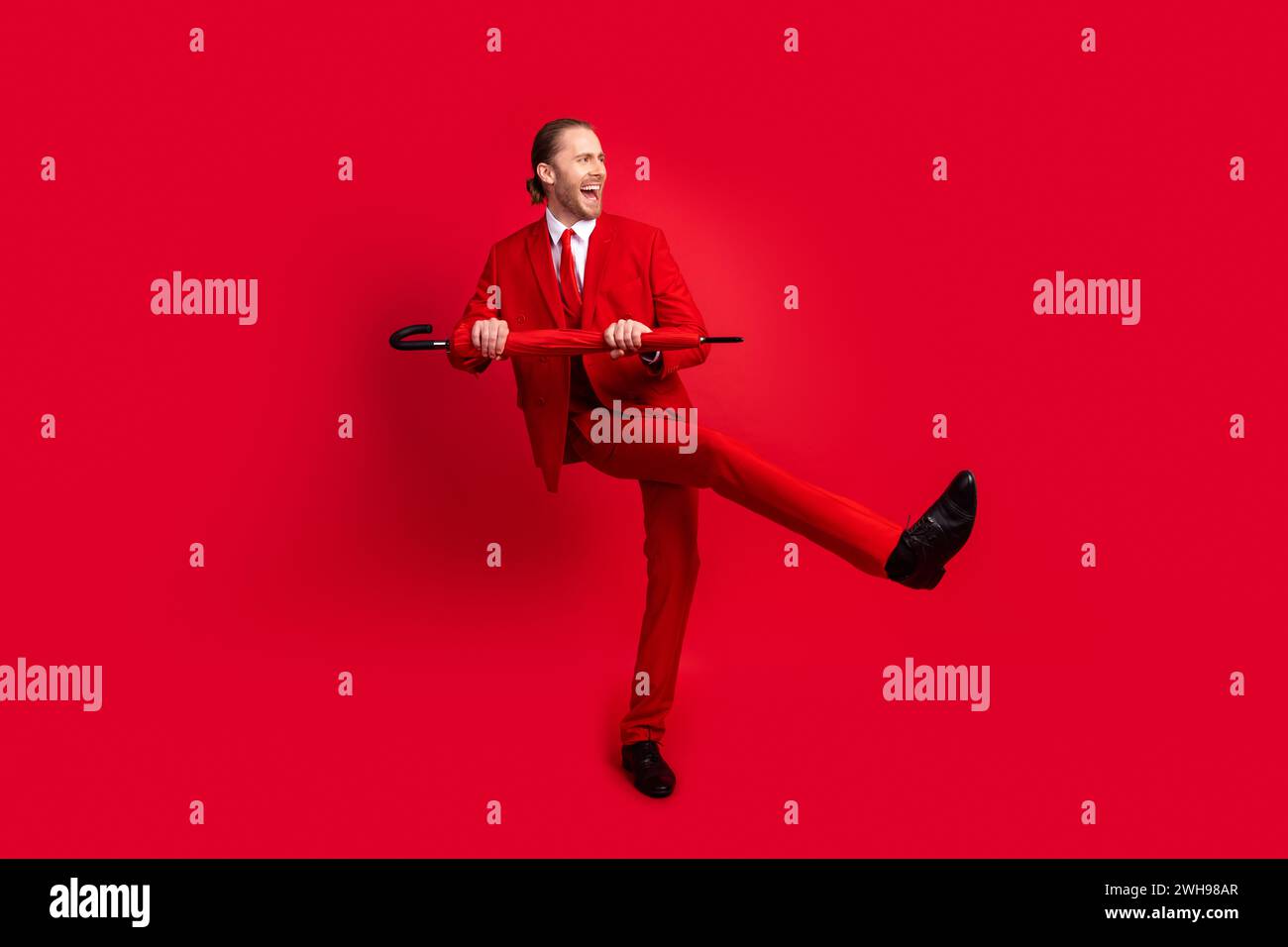Full body photo of attractive young man dancing energetic umbrella ...