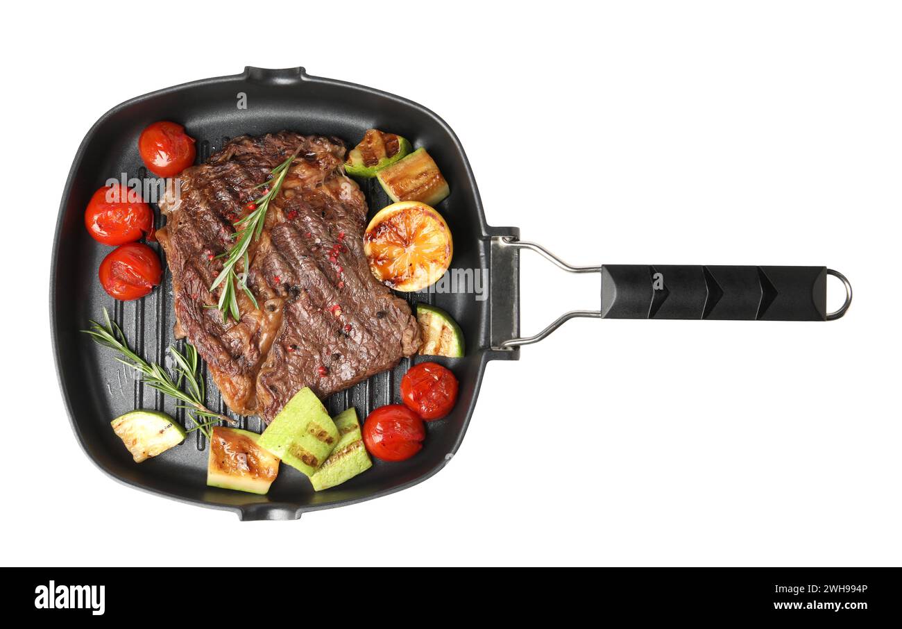 Delicious grilled beef steak and vegetables in frying pan isolated on ...