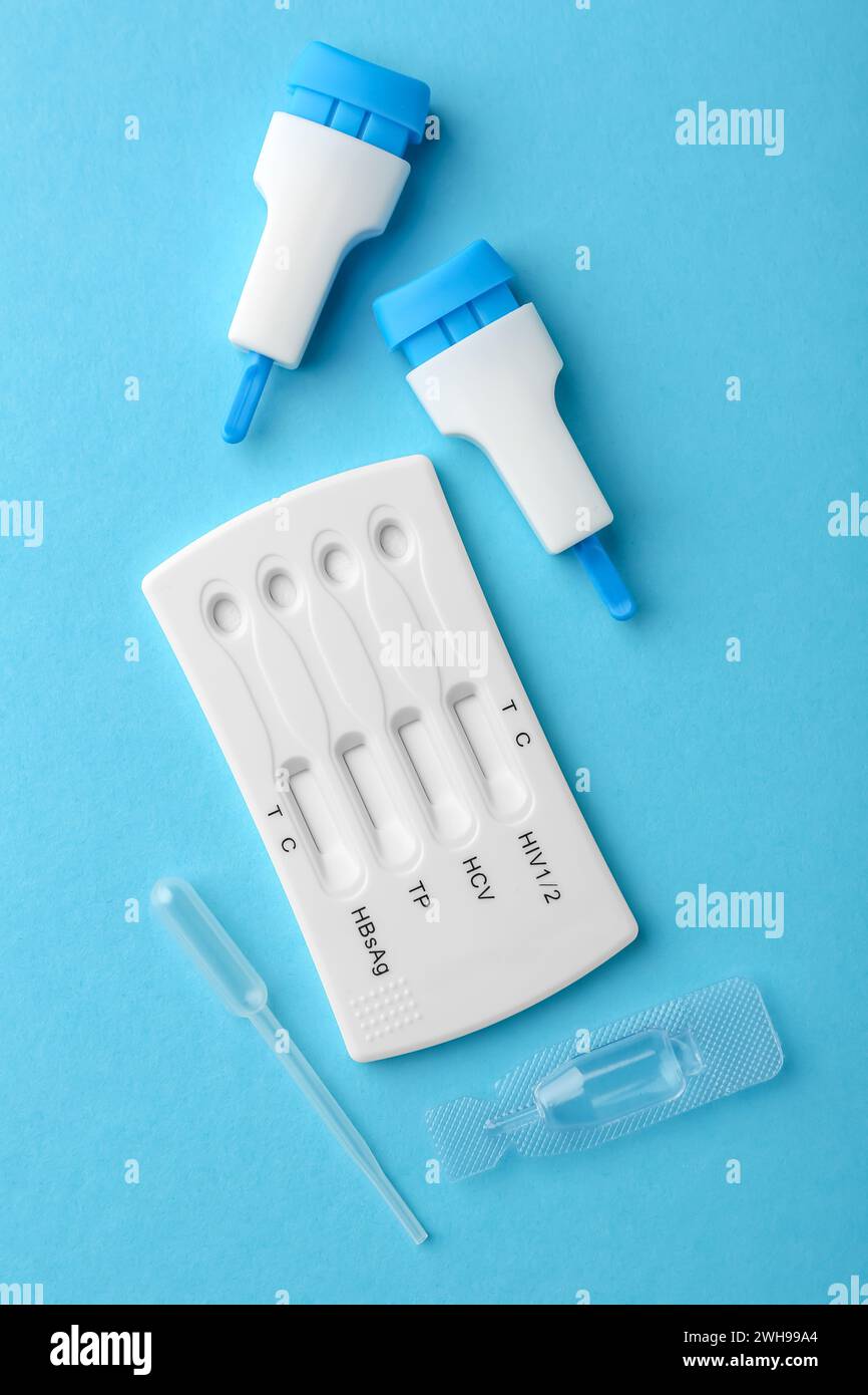 Disposable multi-infection express test kit on light blue background ...