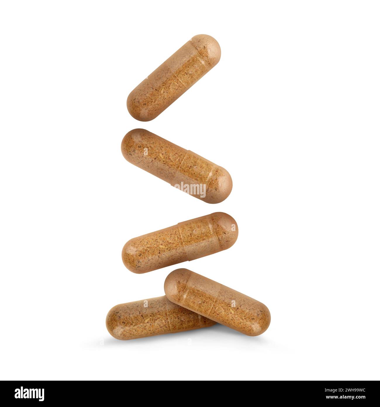 Vitamin. Many capsules falling on white background Stock Photo - Alamy