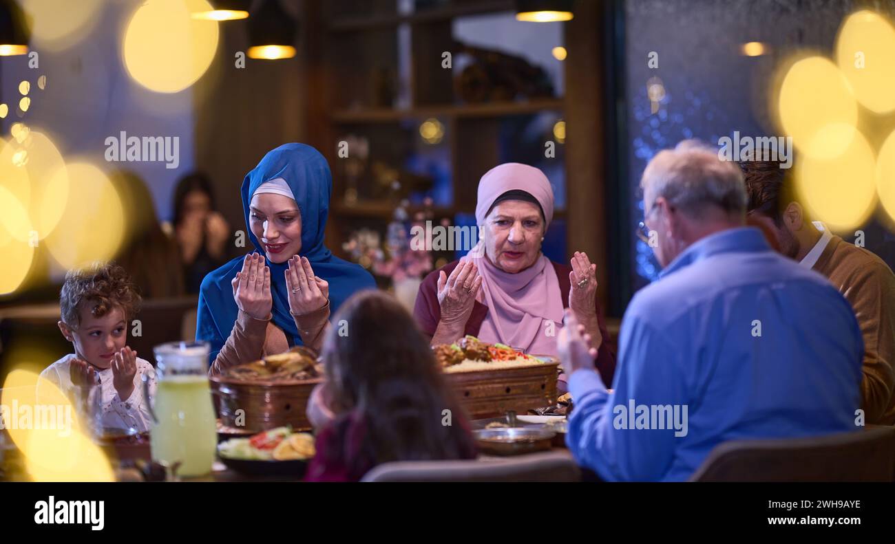 In a modern restaurant setting, a European Islamic family comes ...