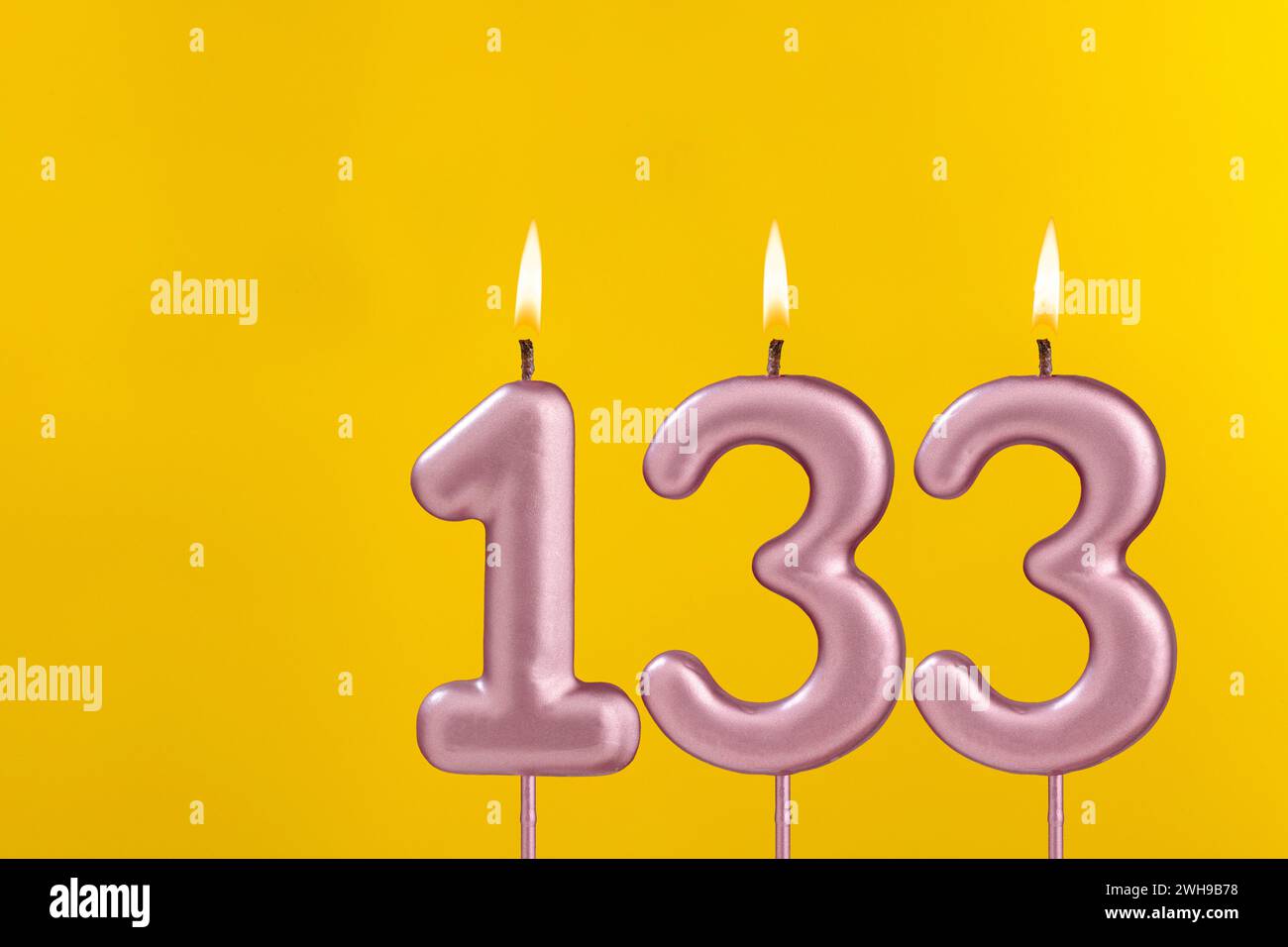 Birthday candle number 133 - Birthday celebration on yellow background ...