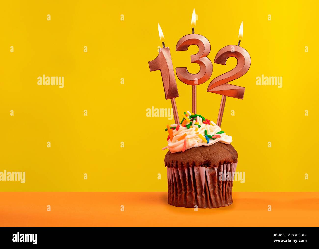 Number 132 birthday candle - Celebration on yellow background Stock ...